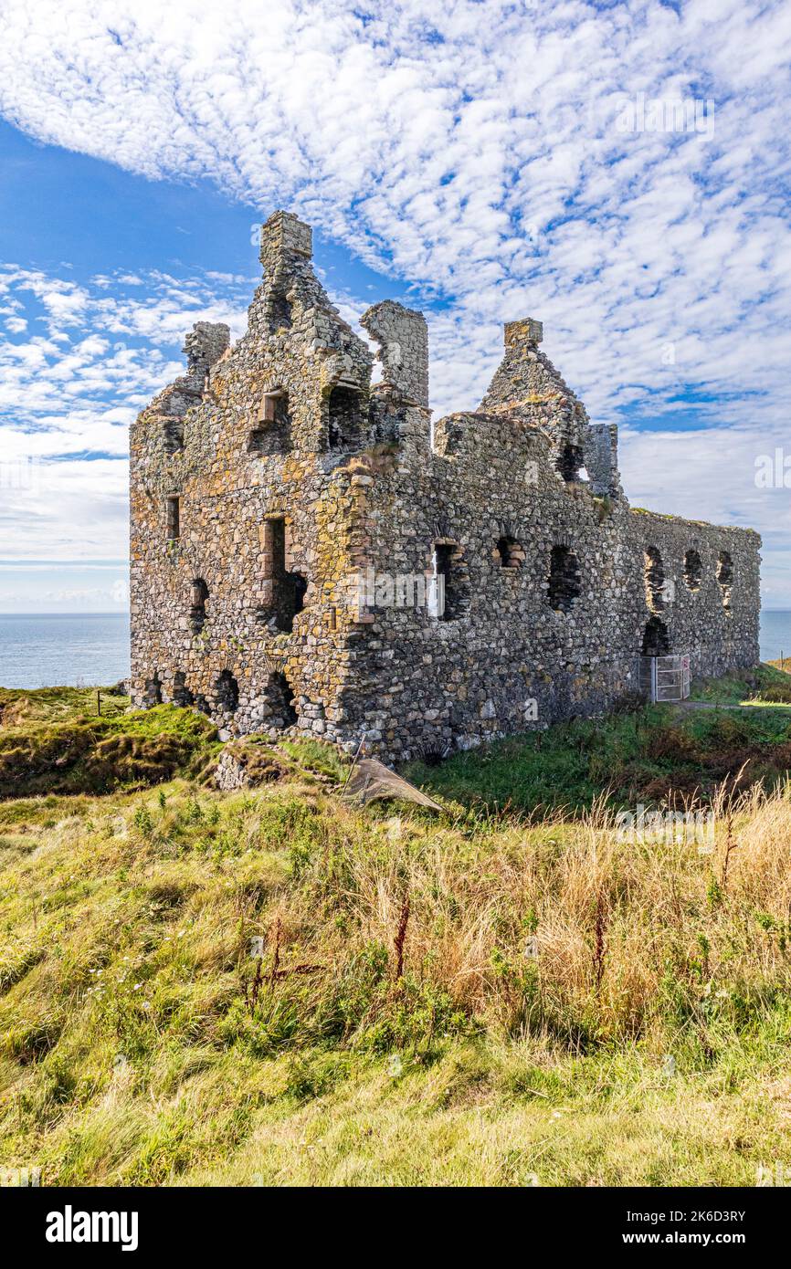 The ruins of 12th century Dunskey Castle on a cliff near the seaside ...