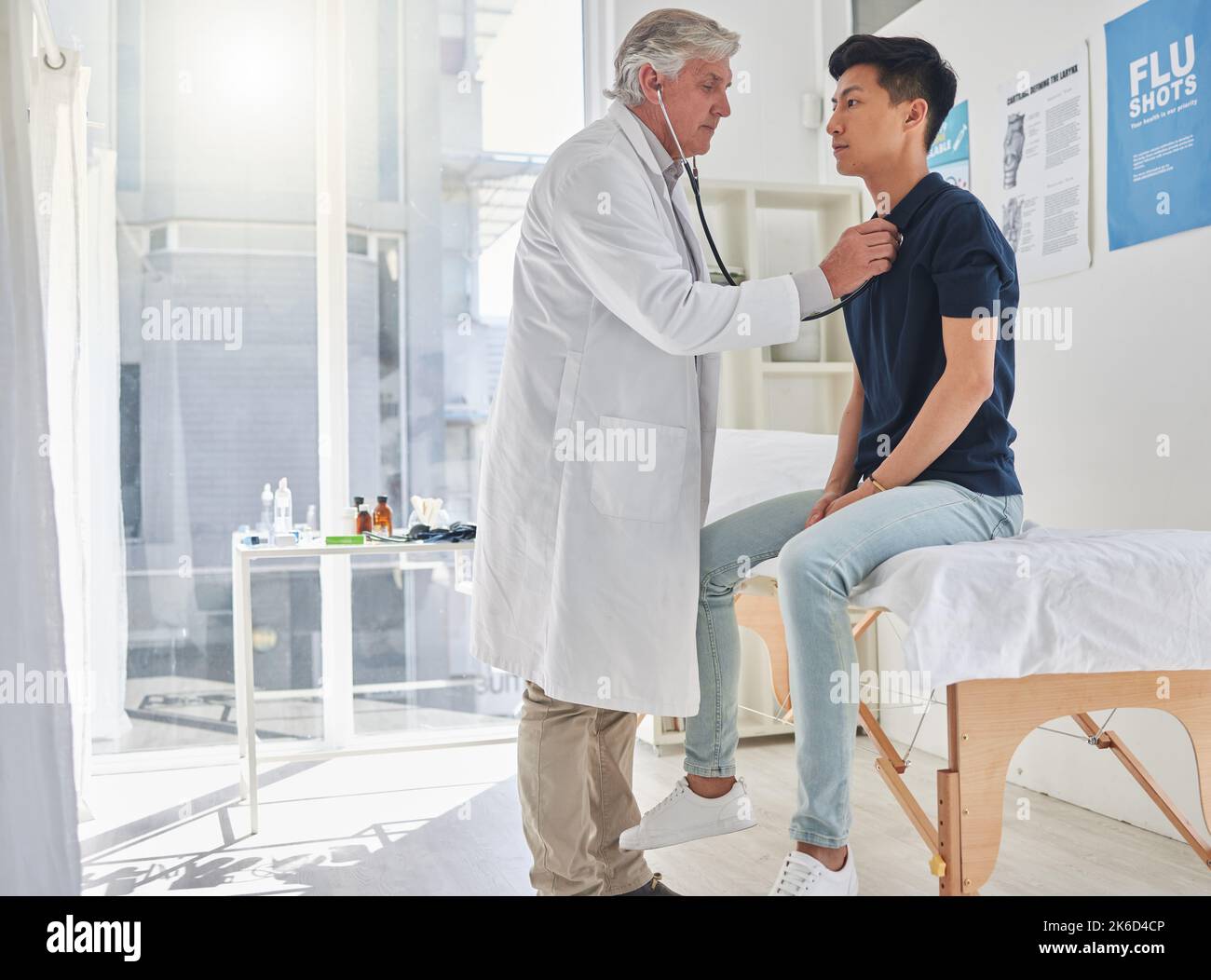 What does your heart say. a mature doctor having a checkup with a ...