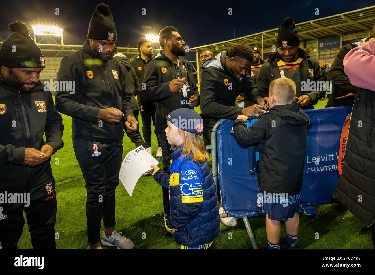 Players from the Papua New Guinea Rugby League squad signs children's ...