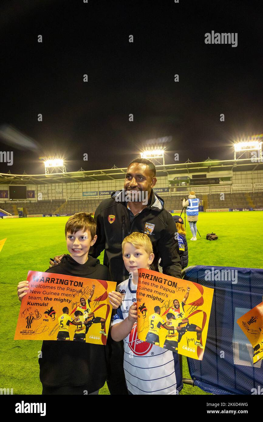 Player from the Papua New Guinea Rugby League squad poses with two ...