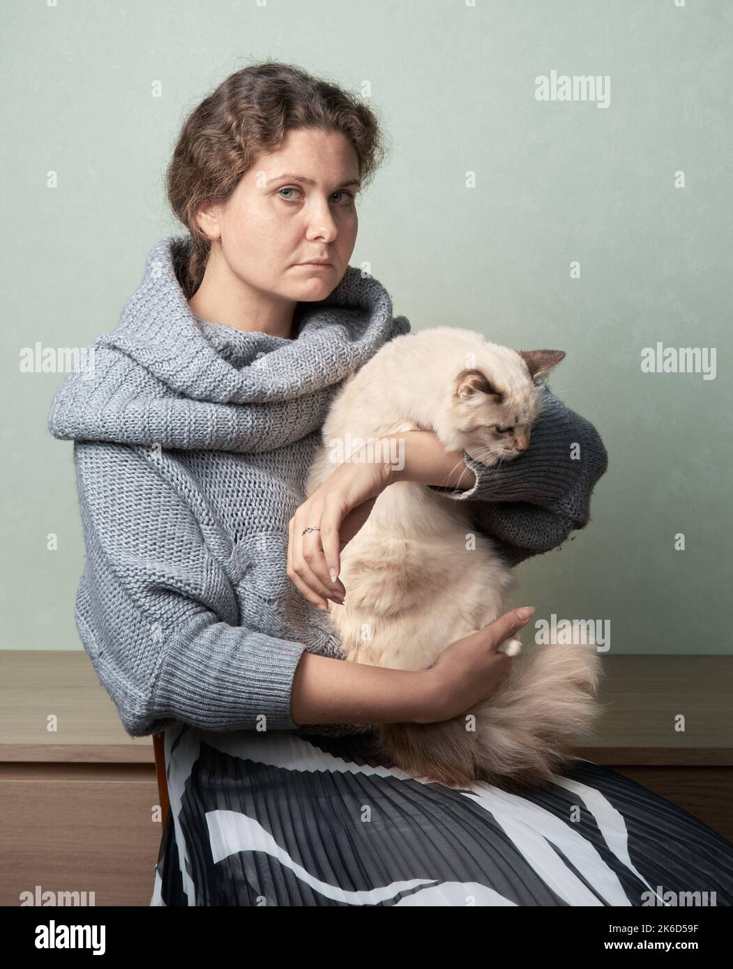 Closeup of woman with a cat in her arms Stock Photo - Alamy