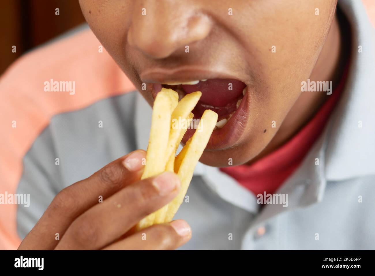 Fat man eating french fries hi-res stock photography and images - Alamy