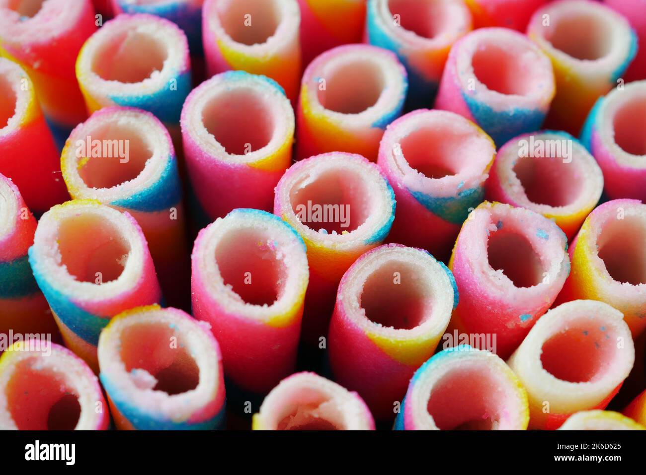 colorful wafer roll chocolate on pink background Stock Photo - Alamy