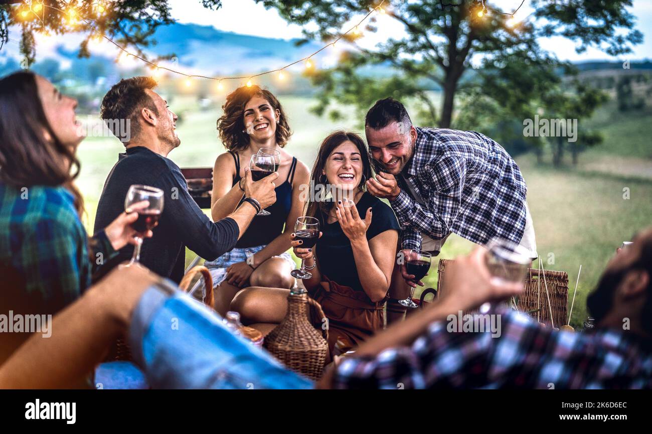 Young friends having fun at vineyard after sunset - Happy people ...