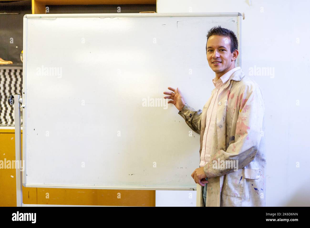 Adult Education: Art Class. An art teacher addressing his students from ...