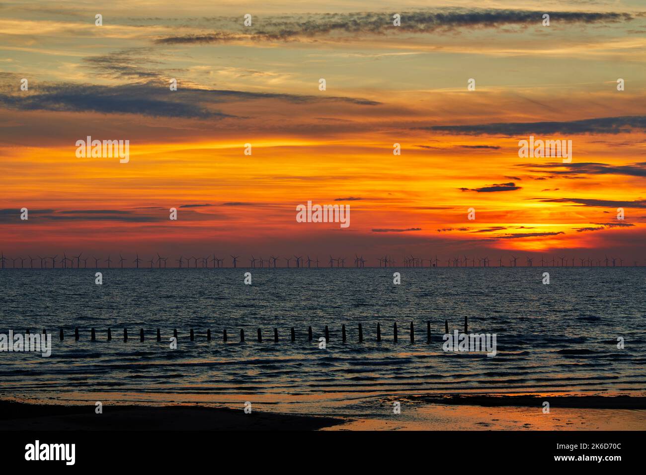 A bright orange sunset sky over Walney Island, Barrow-in-Furness ...