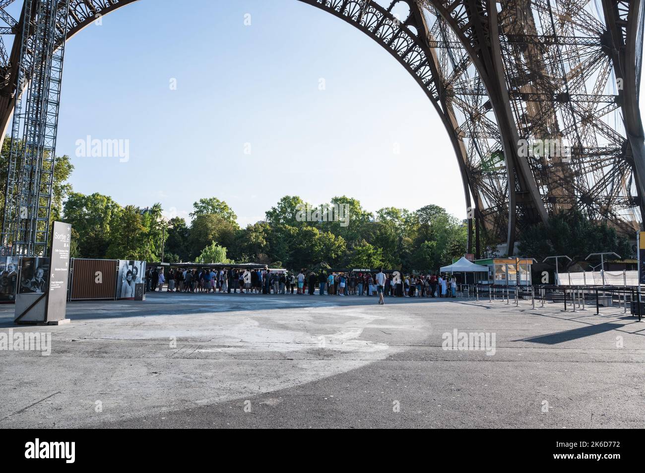 Paris, France - August 27 2022: People queueing to go up the Eiffel ...