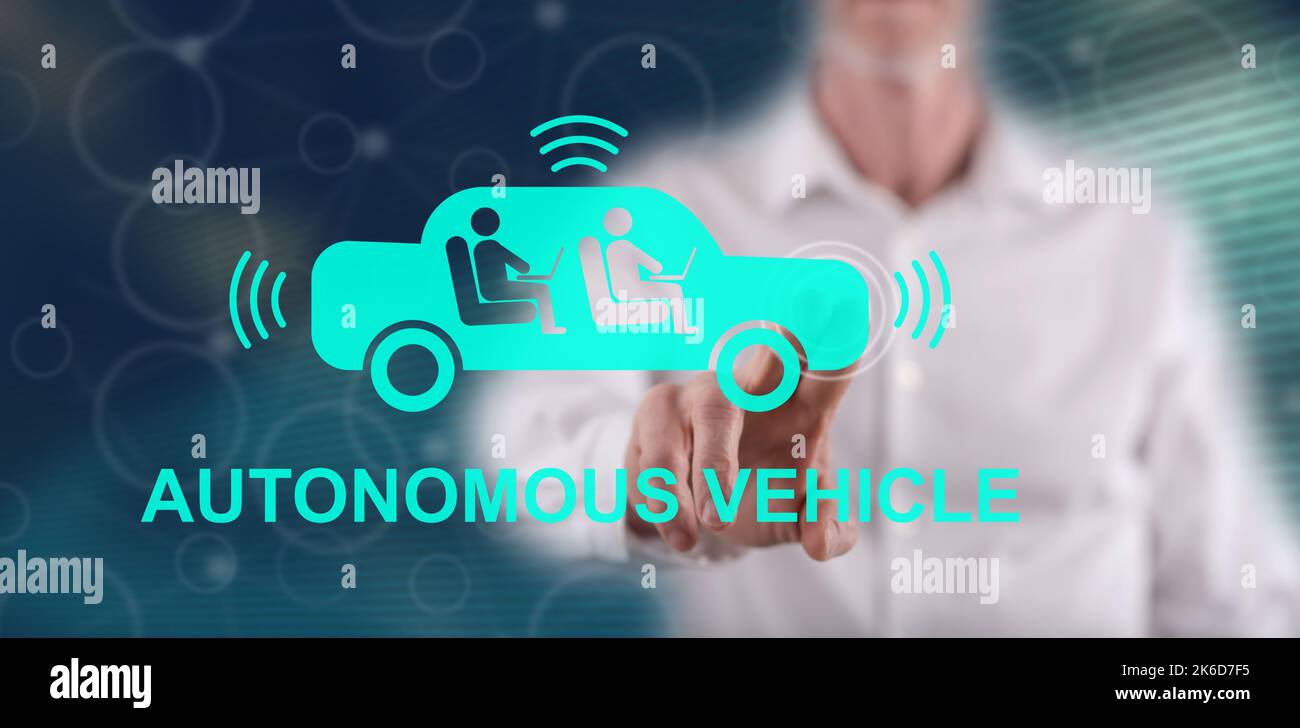 Man touching an autonomous vehicle concept on a touch screen with his ...