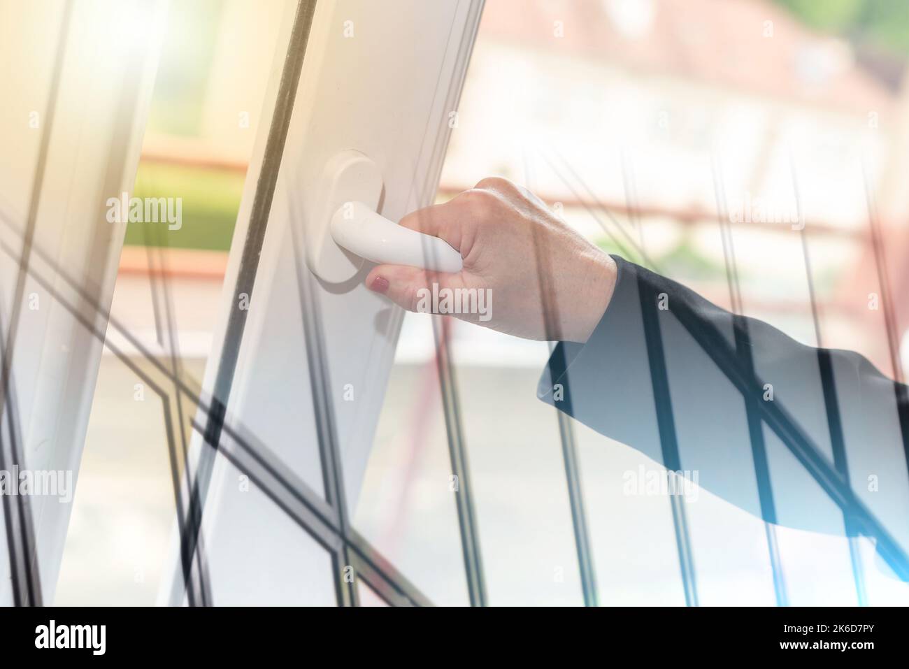 Female hand opening a window; multiple exposure Stock Photo - Alamy