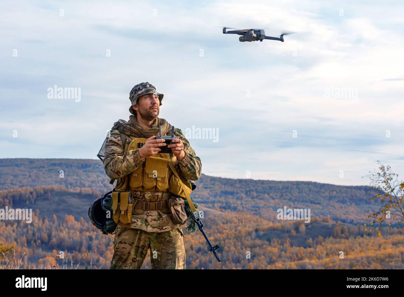 Photo of an artillery spotter or military observer launches a drone ...