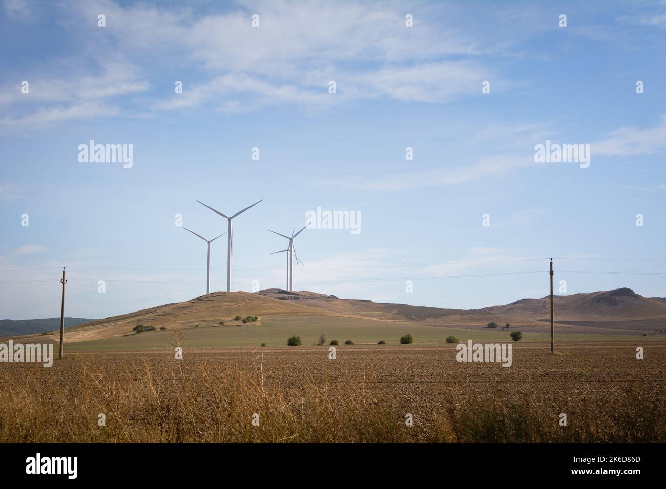 Wind turbines on the hill. Beautiful mountain landscape with wind ...