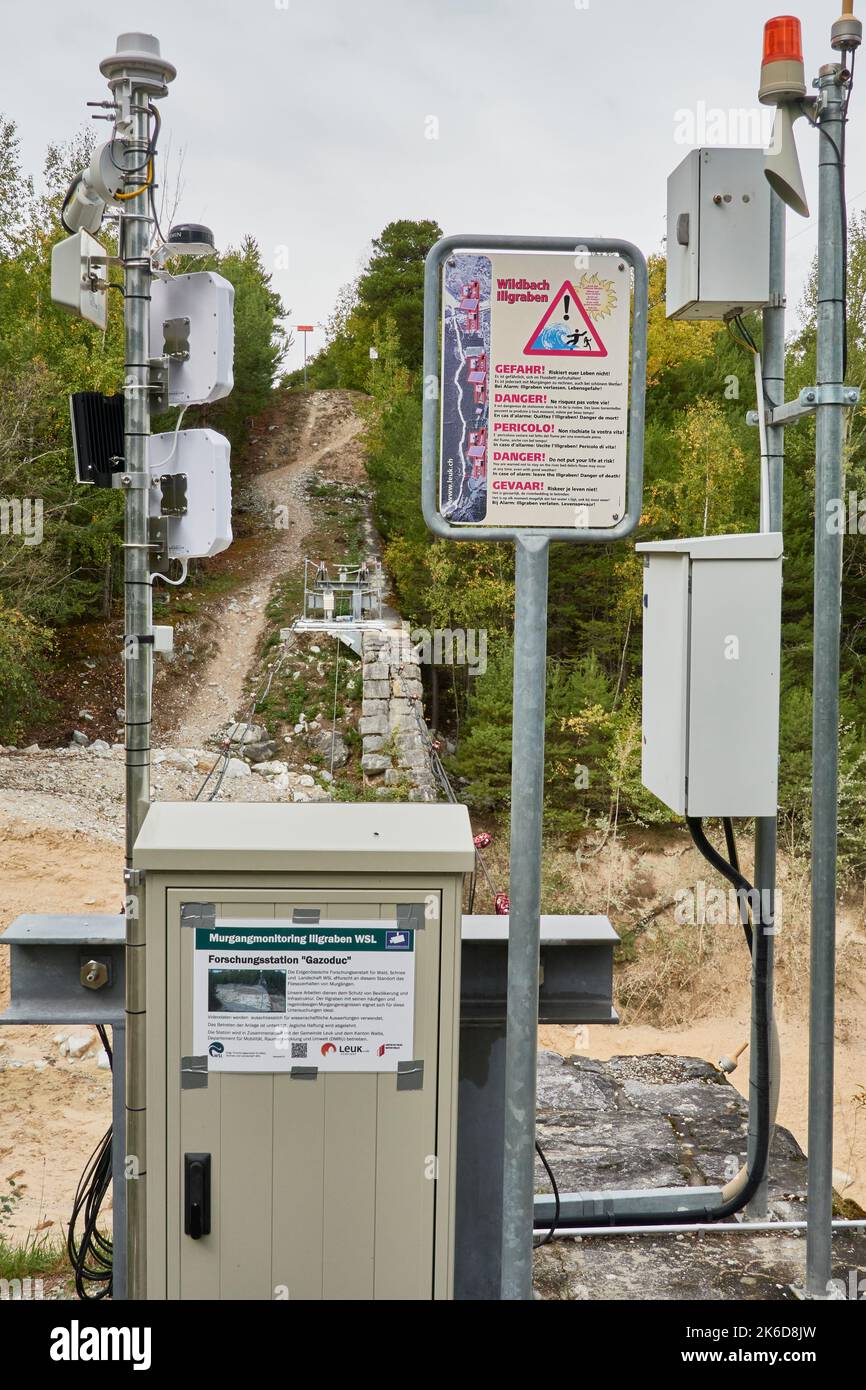 A warning flood sign and monitor devices for a river Stock Photo - Alamy