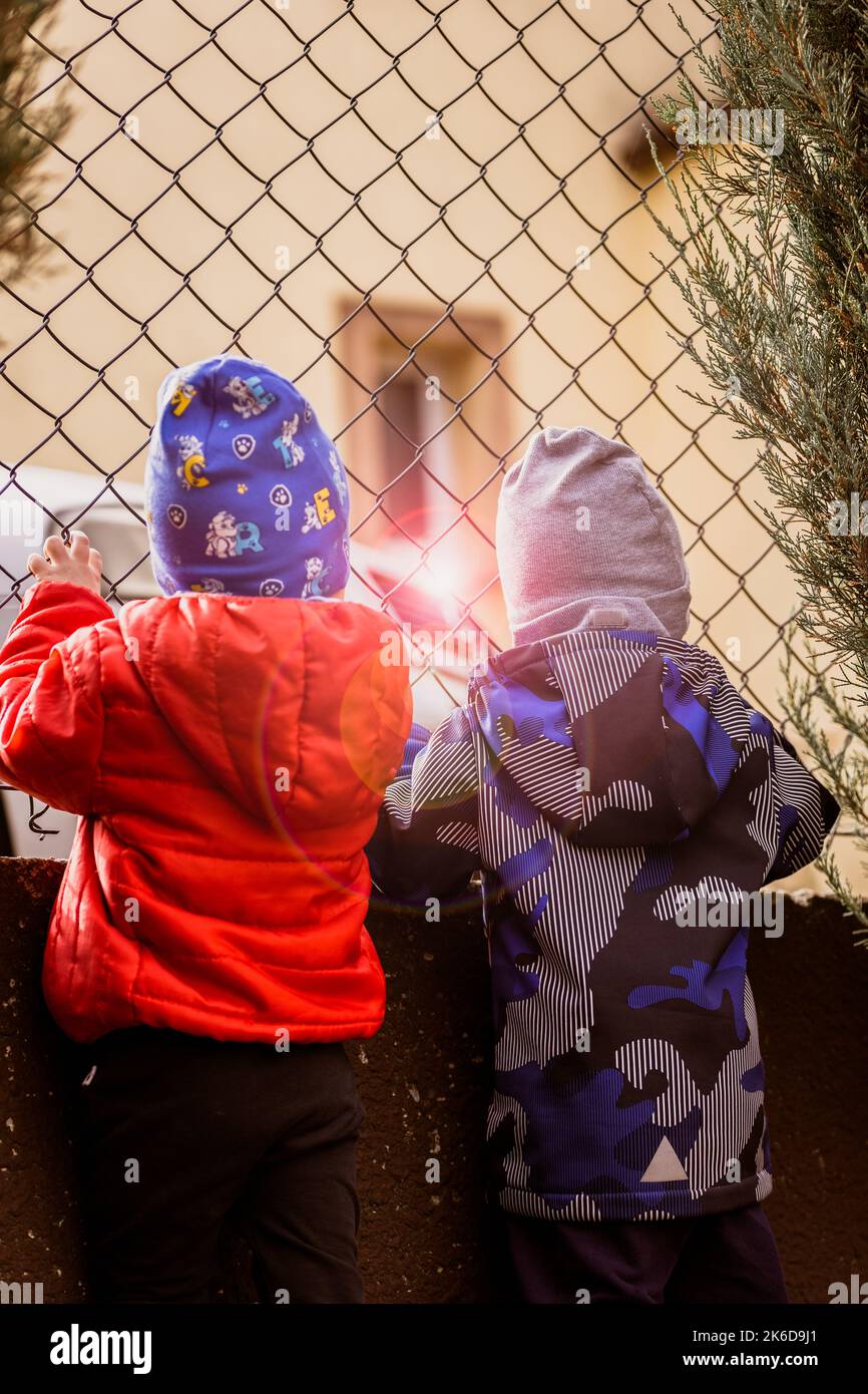 Two children from behind hi-res stock photography and images - Alamy
