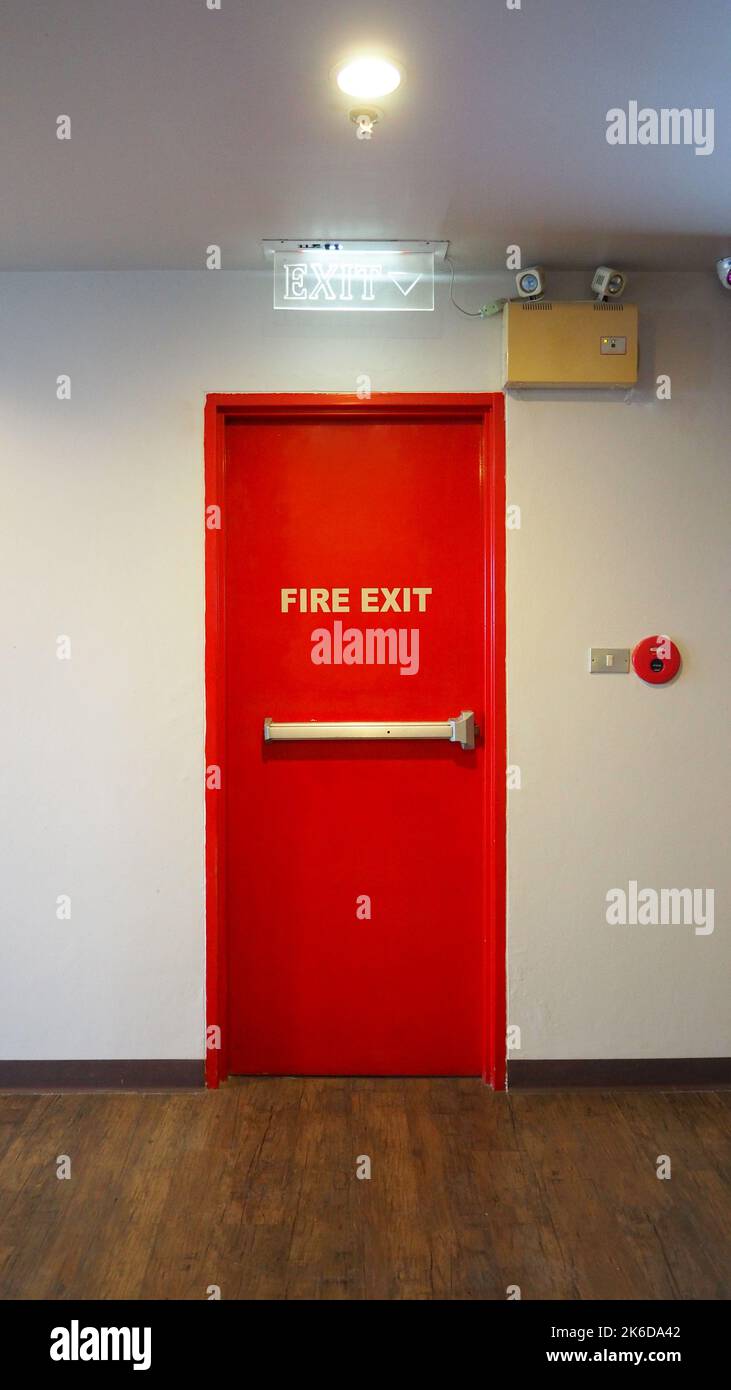 Emergency fire exit door and red color and white wall in building Stock ...