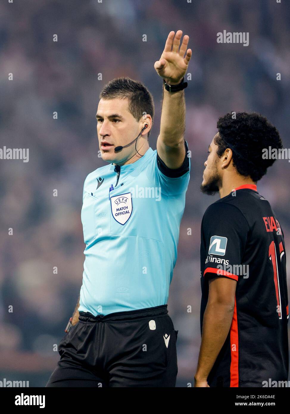 ROTTERDAM, NETHERLANDS - OCTOBER 13: Referee Rade Obrenovic, Evander of ...
