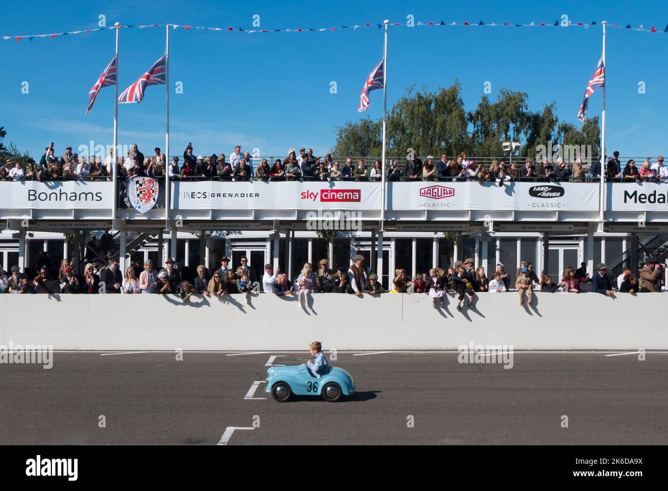 Kids racing in their Austin J40 pedal cars on the straight in the ...