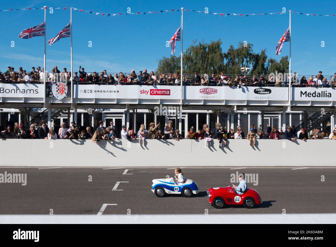 Kids racing in their Austin J40 pedal cars on the straight in the ...
