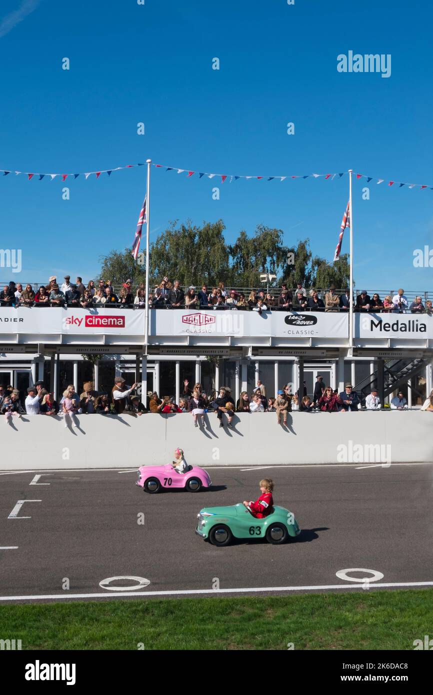 Kids racing in their Austin J40 pedal cars on the straight in the ...
