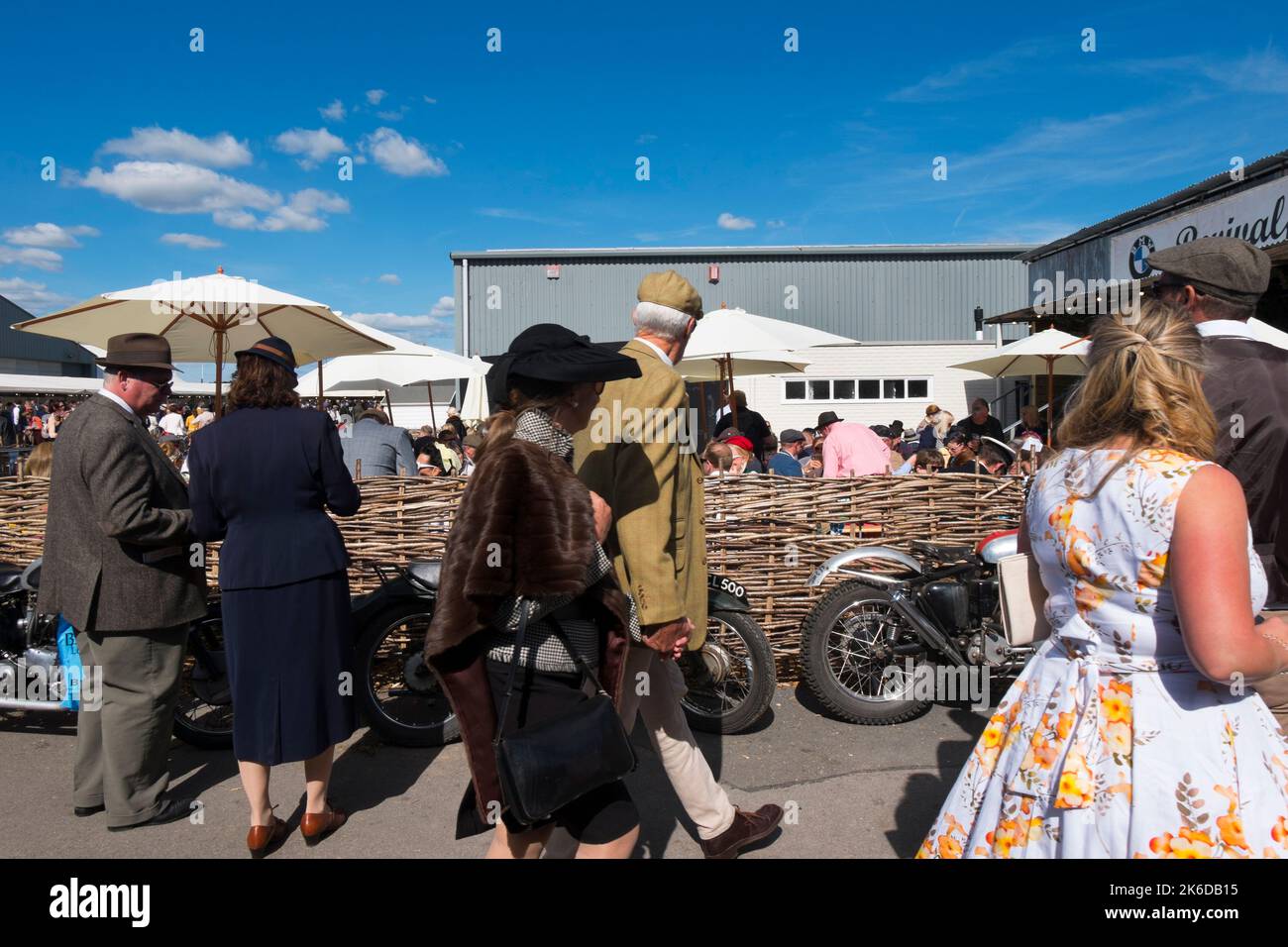 People in vintage period dress at the BMW Revivalfest area next to the ...