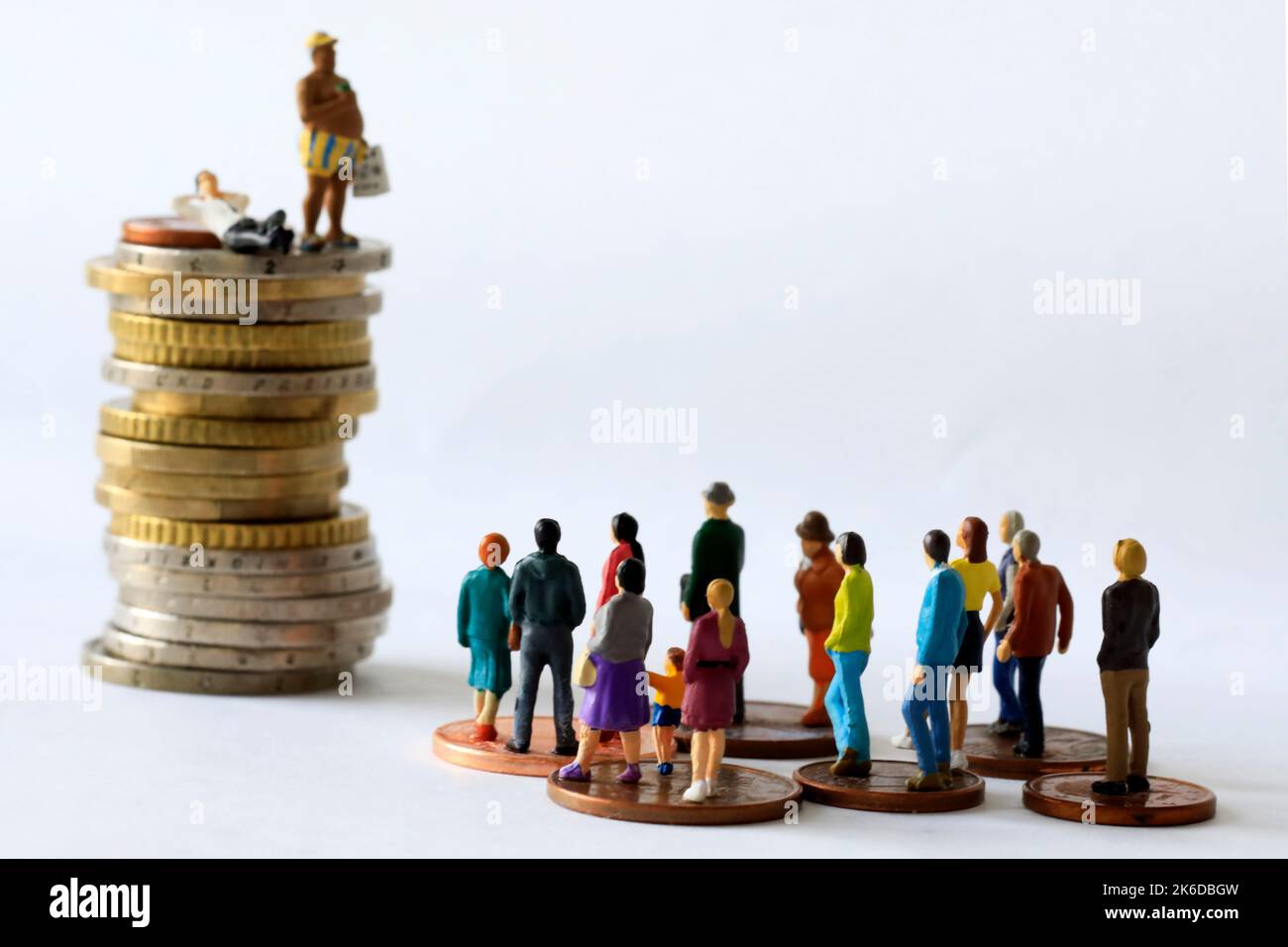 Economic inequality expressed by a difference in coin height Stock ...