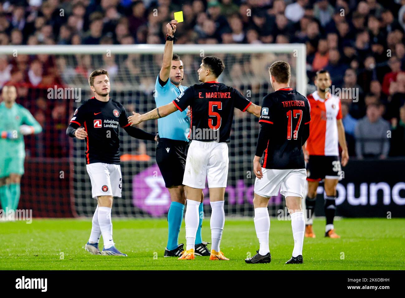 ROTTERDAM, NETHERLANDS - OCTOBER 13: Referee Rade Obrenovic shows ...