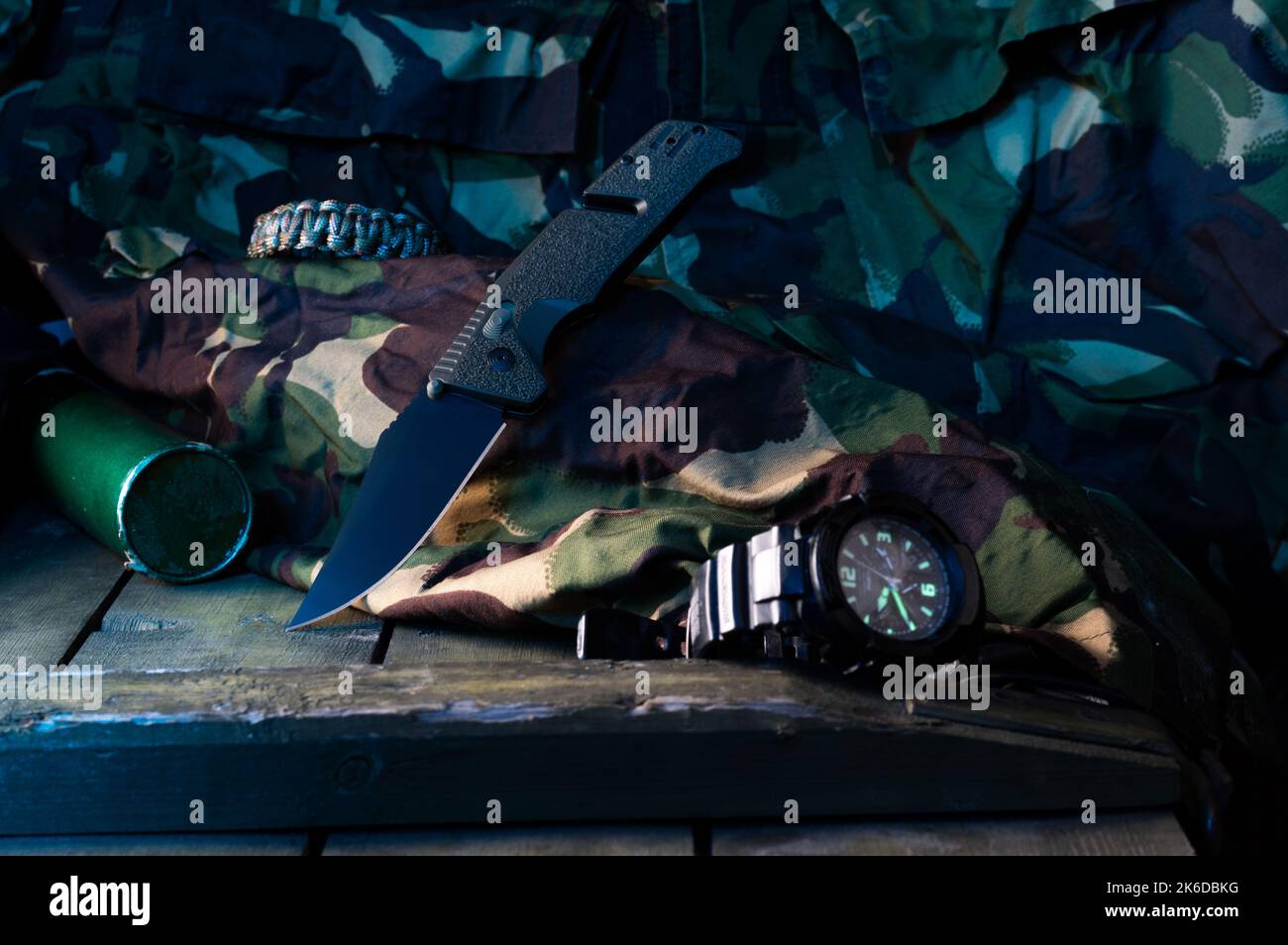 Army knife and military watch. Anti-shock knives and a sharp knife ...