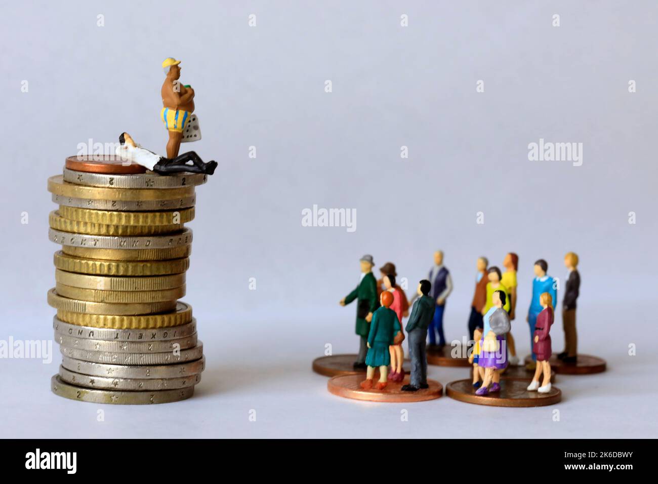 Economic inequality expressed by a difference in coin height Stock ...