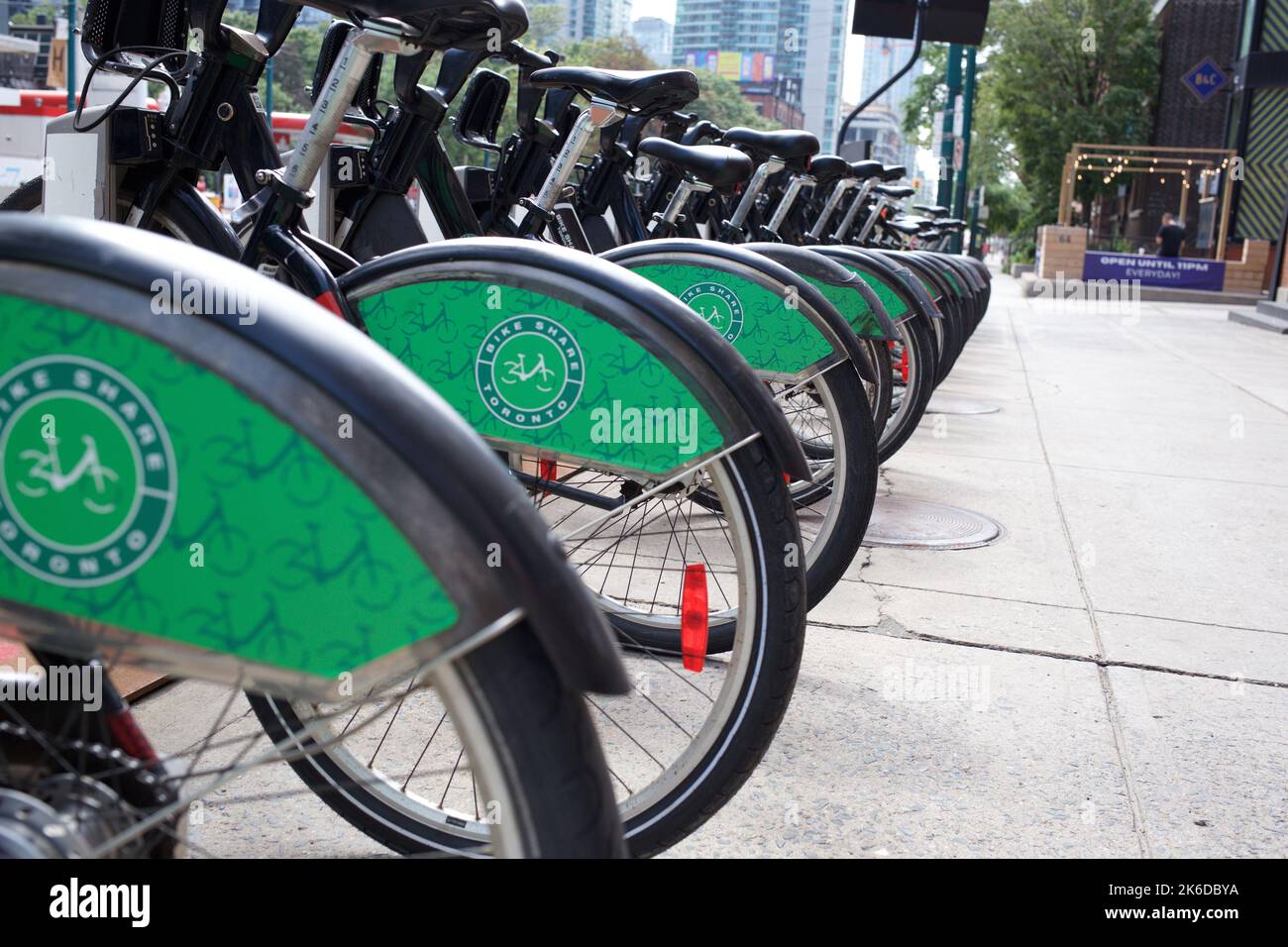 A closeup of bikes parked on a street in downtown Toronto, as part of the Toronto Bike Share ...