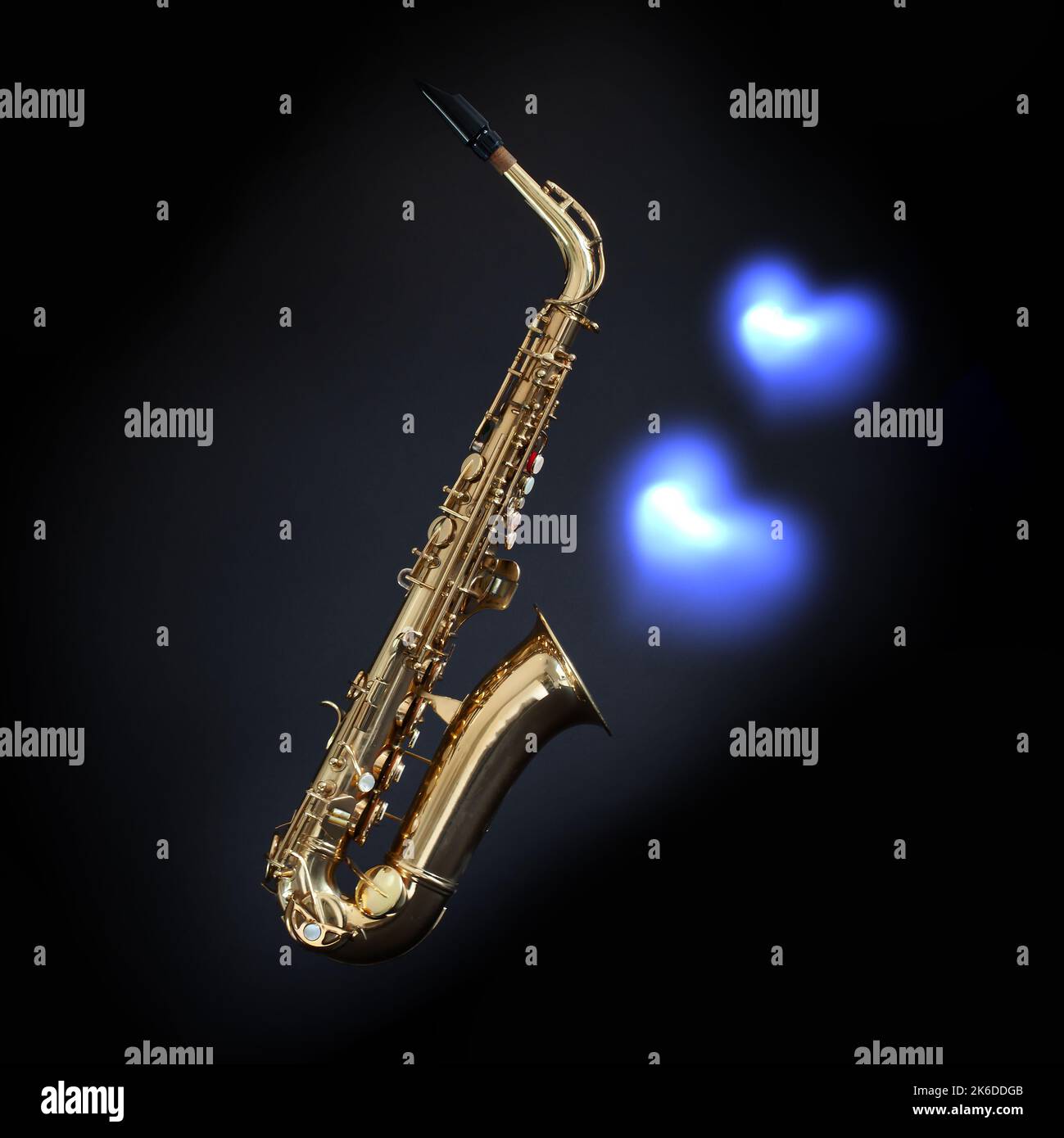 Saxophone on black background with blue hearts music coming out of the ...