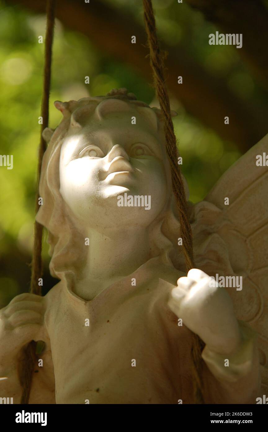 Angel on a swing hi-res stock photography and images - Alamy