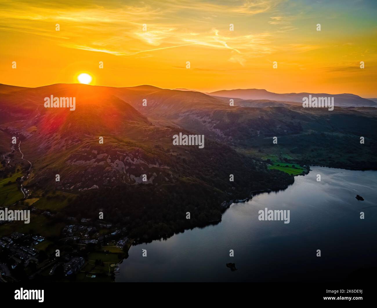 Aerial view of sunset over Ullswater lake in Lake District, a region ...