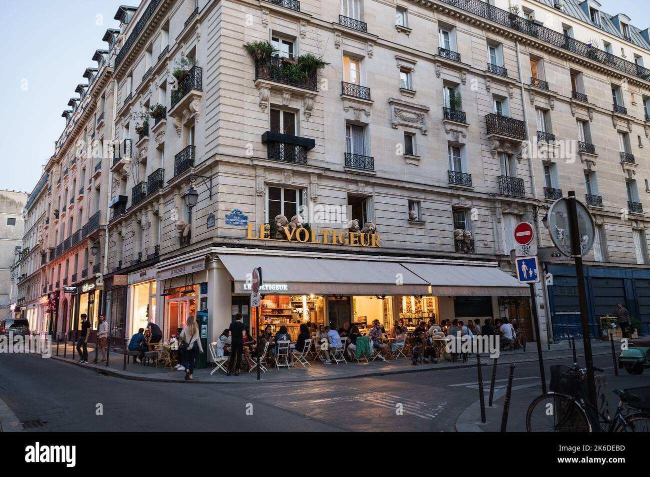 Paris, France - August 27 2022: People walking and dining in cafe in ...