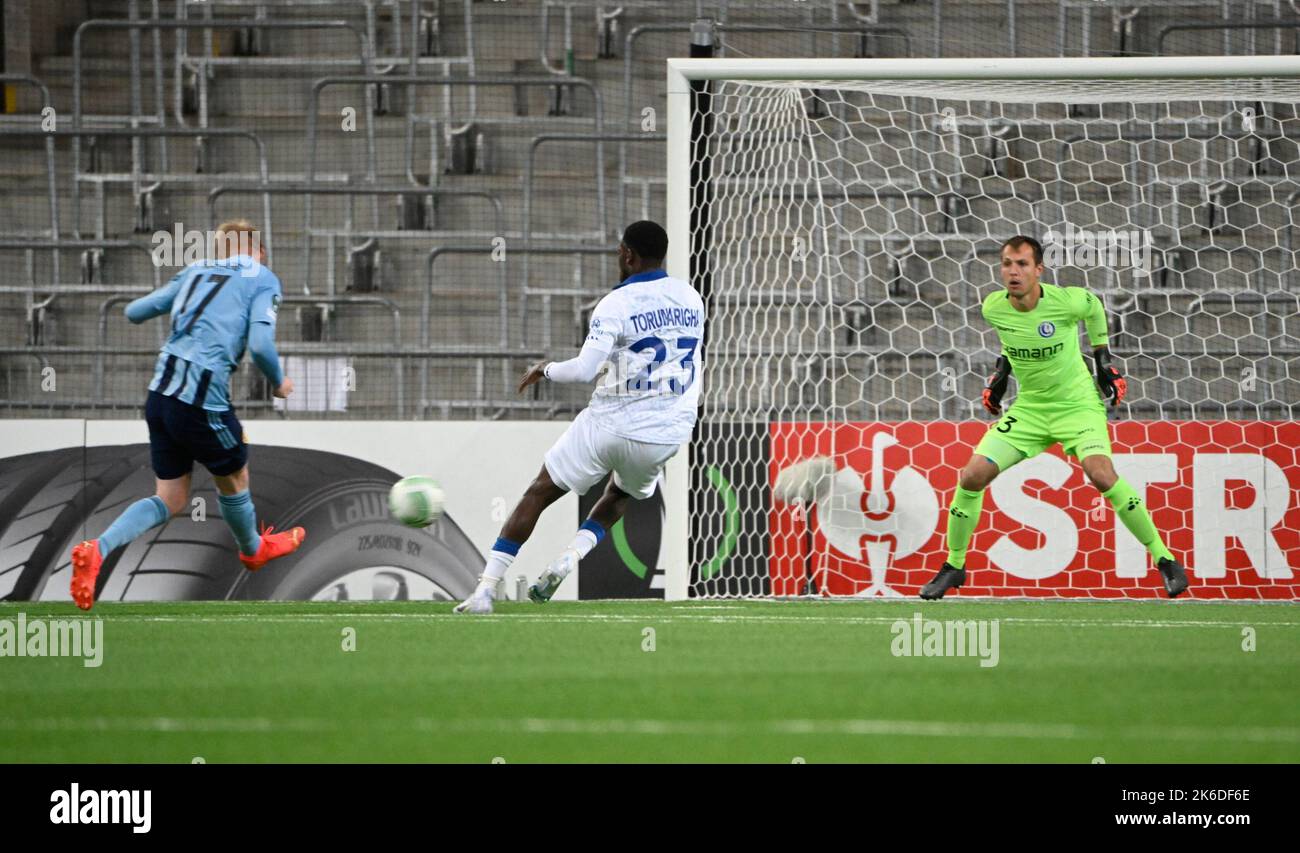 Djurgardens Karl Holmberg celebrates (L) scores behind Gents goalkeeper ...