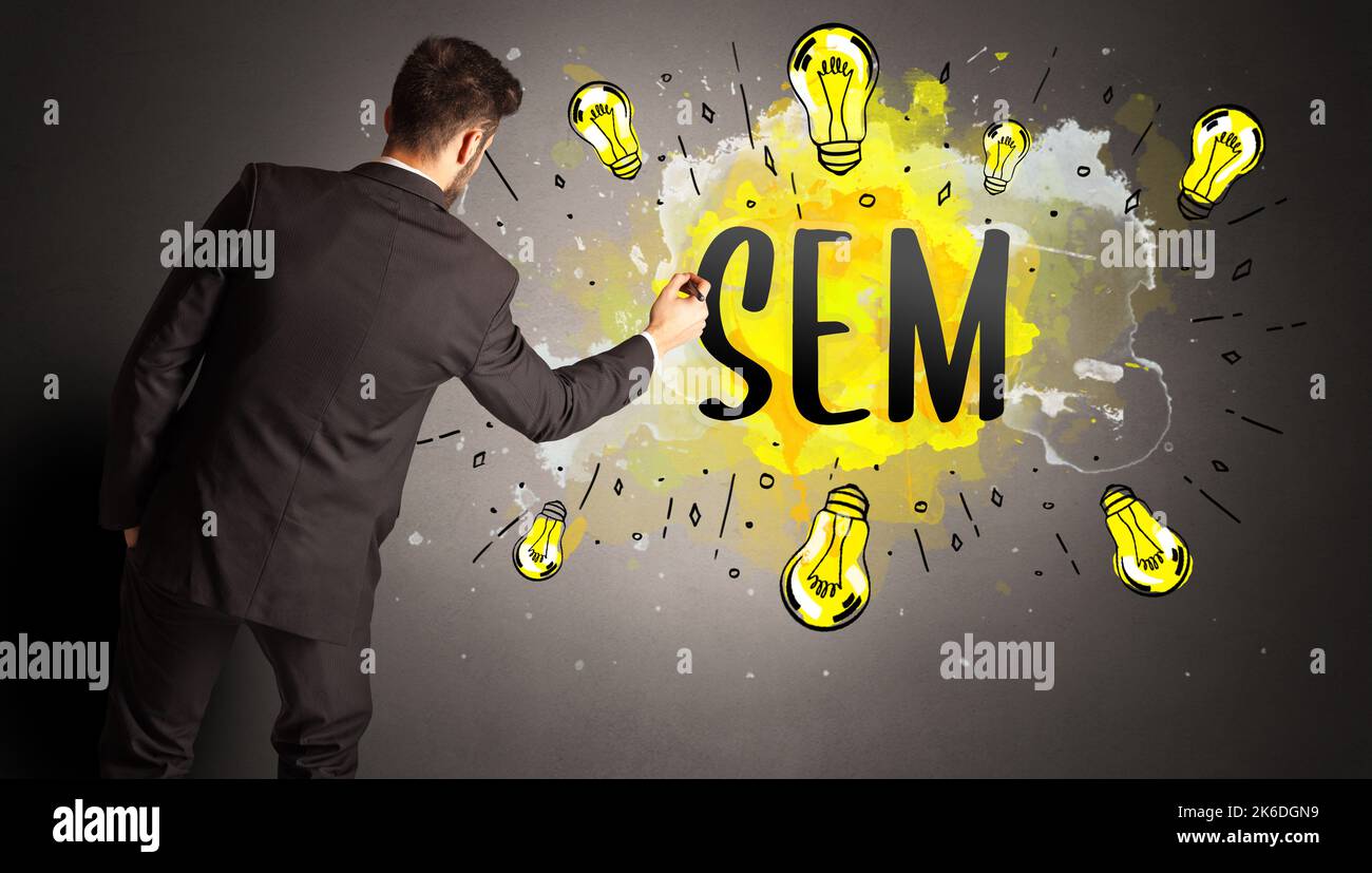 man drawing colorful light bulb Stock Photo - Alamy