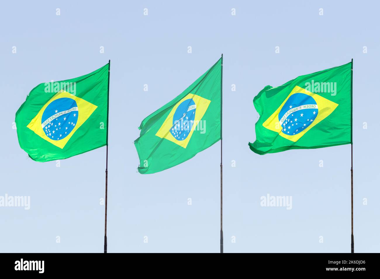 Goiânia, Goias, Brazil – October 02, 2022: Three flags of Brazil waving in the wind with the sky ...