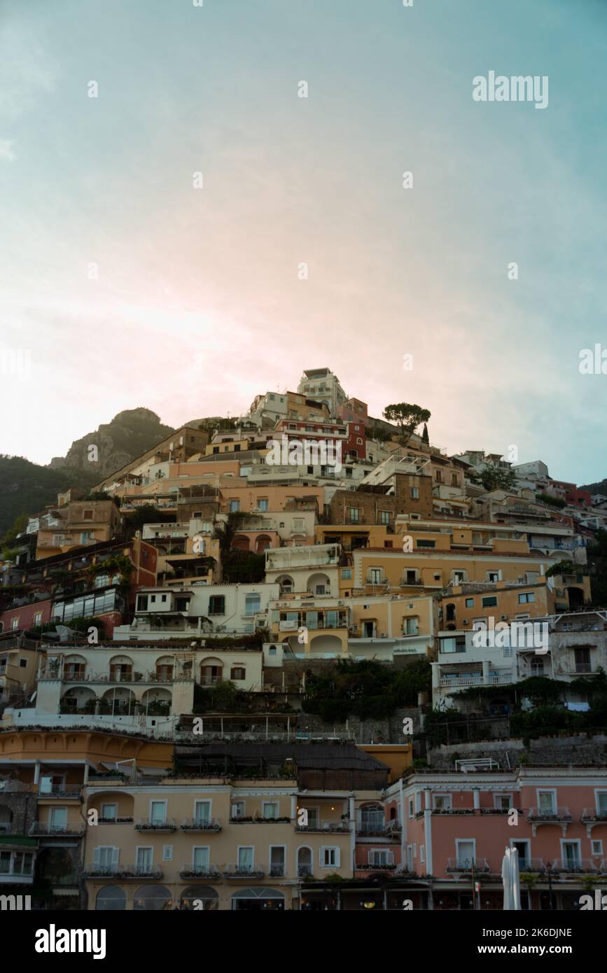 A vertical aerial view of the buildings on the coast of Positano, Italy ...