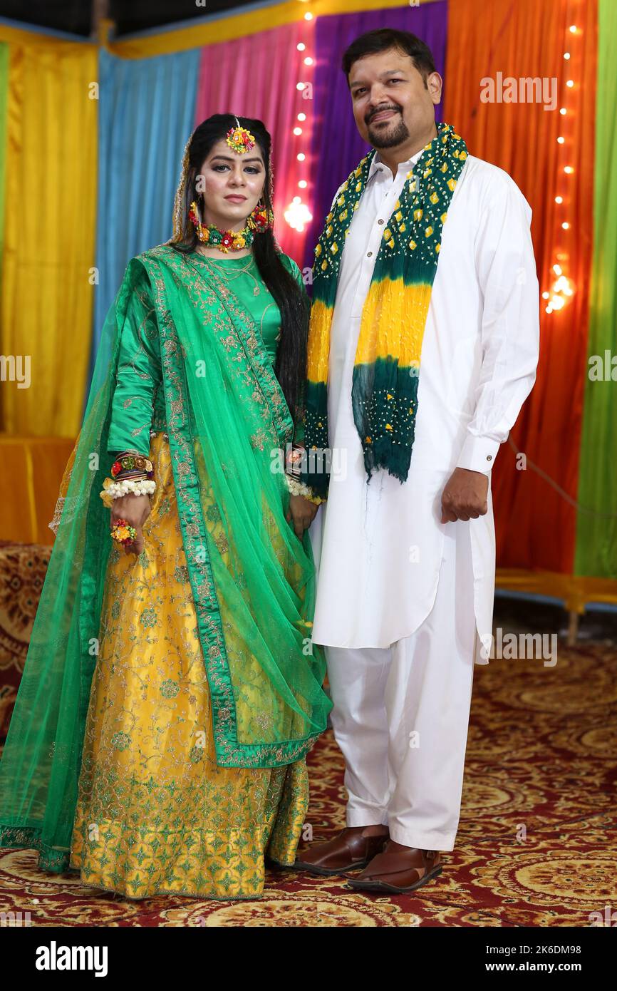 Bride and Groom at Traditional Mayoon ceremony at colorfully decorated ...