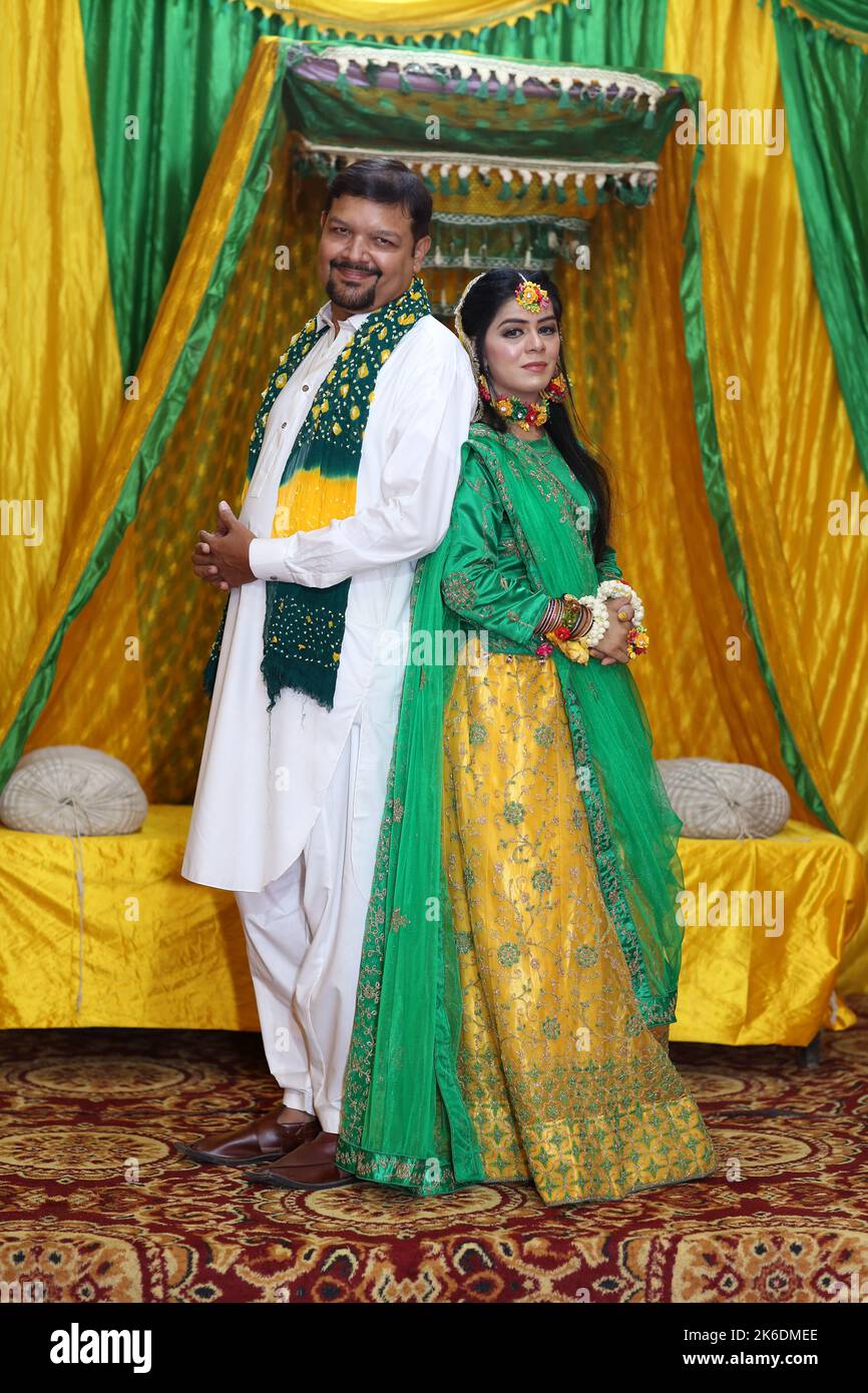 Bride and Groom at Traditional Mayoon ceremony at colorfully decorated ...