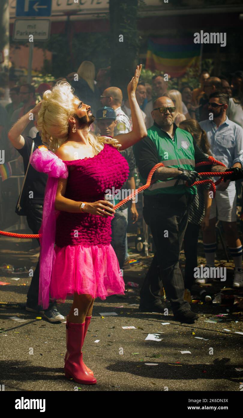 A vertical shot of a drag queen dressed in pink during the Christopher ...