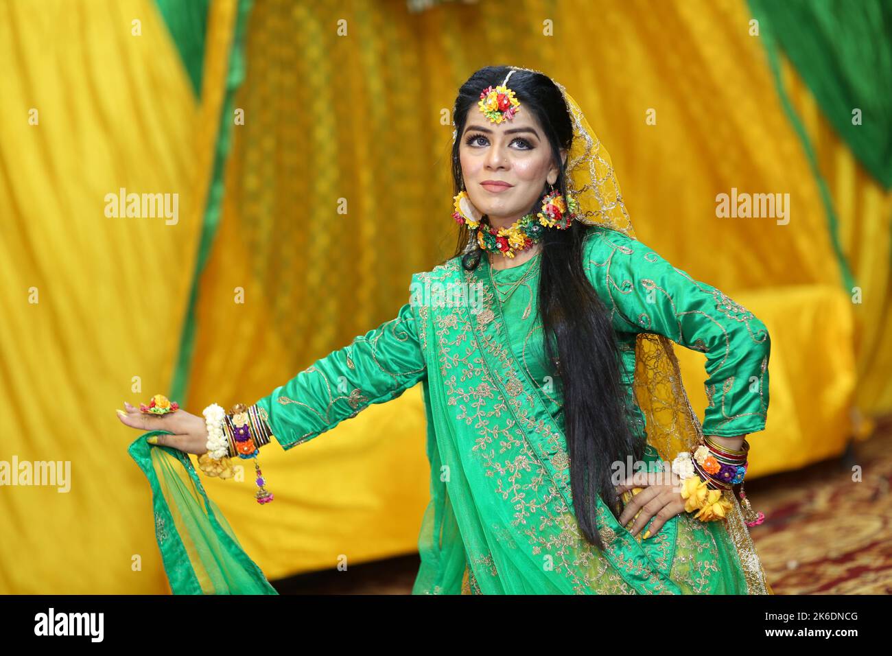 Bride at Traditional Mayoon ceremony at colorfully decorated venue in ...