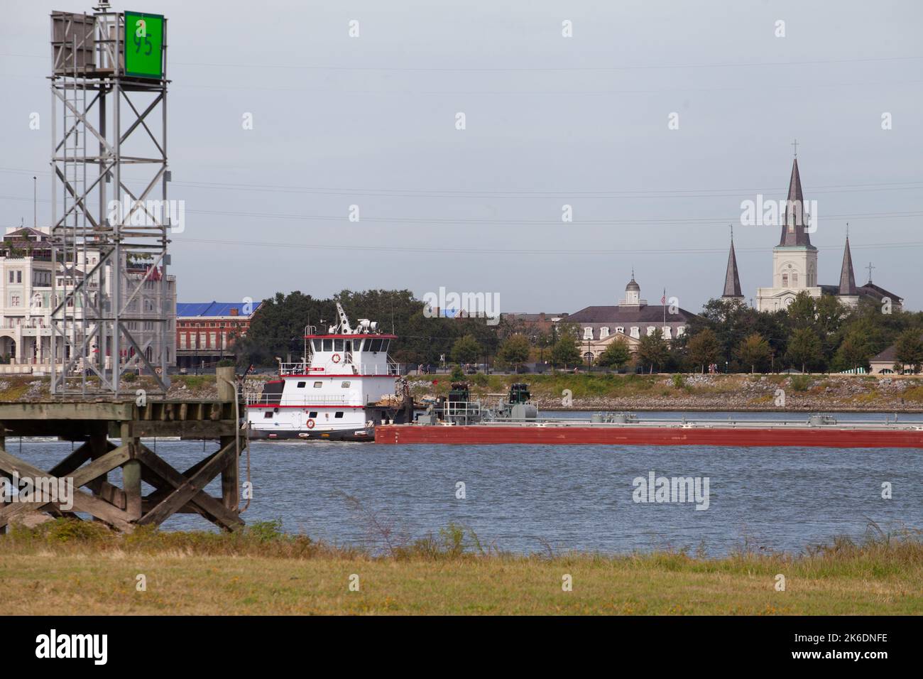 The mv. Mary Kay pushes a tow of barges downriver past New Orleans, La ...