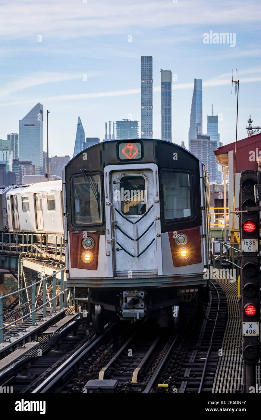 number 7 train approaching Queensboro Plaza subway station with view of Manhattan, New York City ...