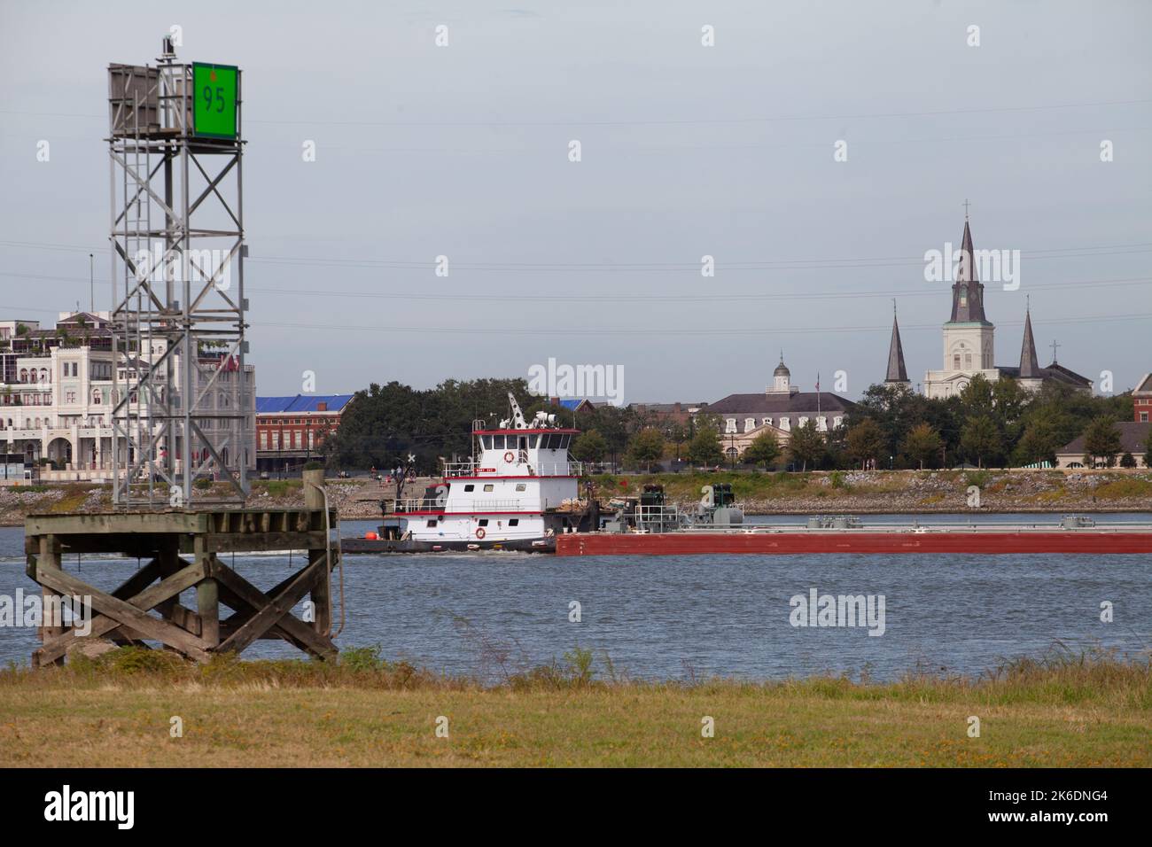 The mv. Mary Kay pushes a tow of barges downriver past New Orleans, La ...