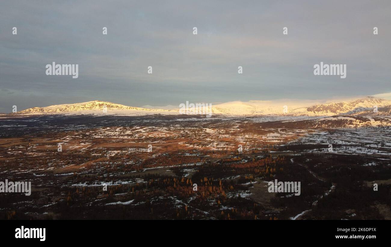 An aerial scenery of the snowy nature of Valdres traditional district ...