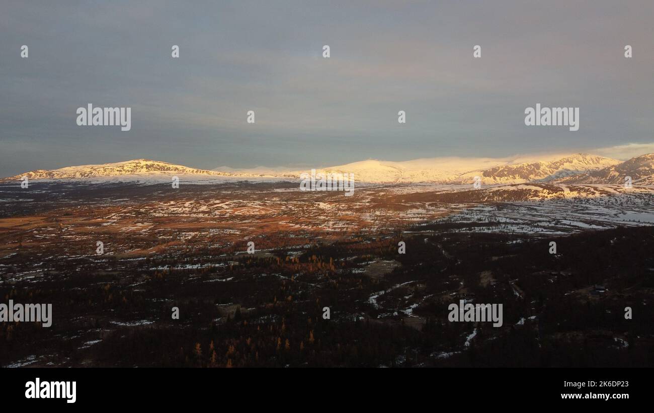 An aerial scenery of the snowy nature of Valdres traditional district ...