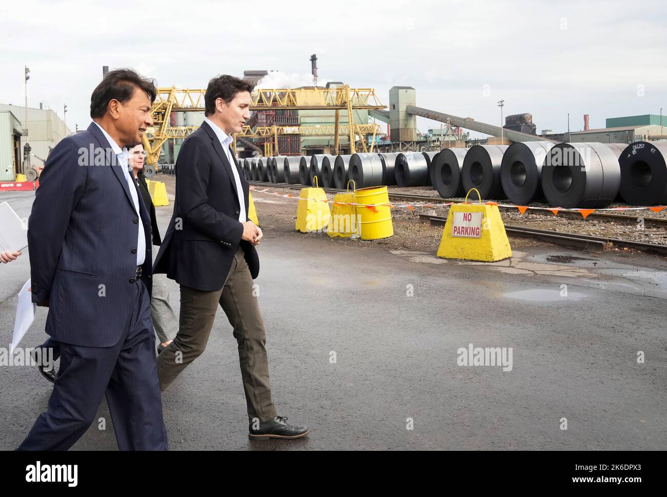 Canadian Prime Minister Justin Trudeau, right, walks with ArcelorMittal ...