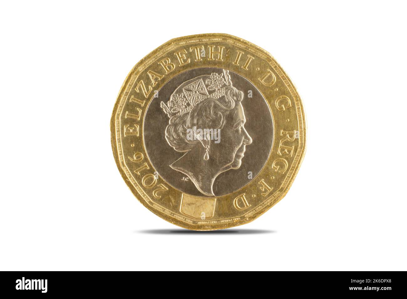A close-up shot of the British one pound coin over a white background ...