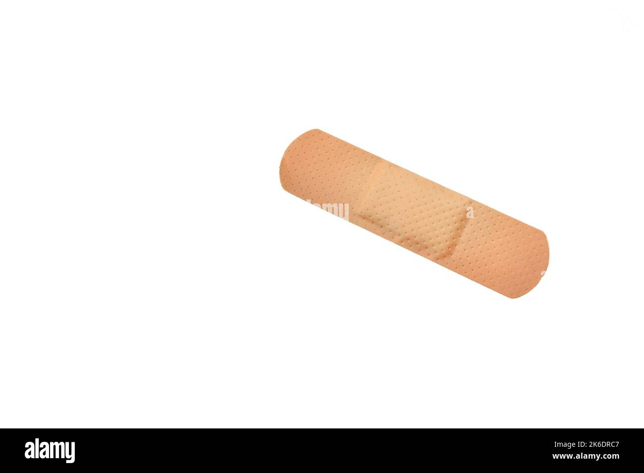 Brown medical band-aid on white background with space for writing text ...