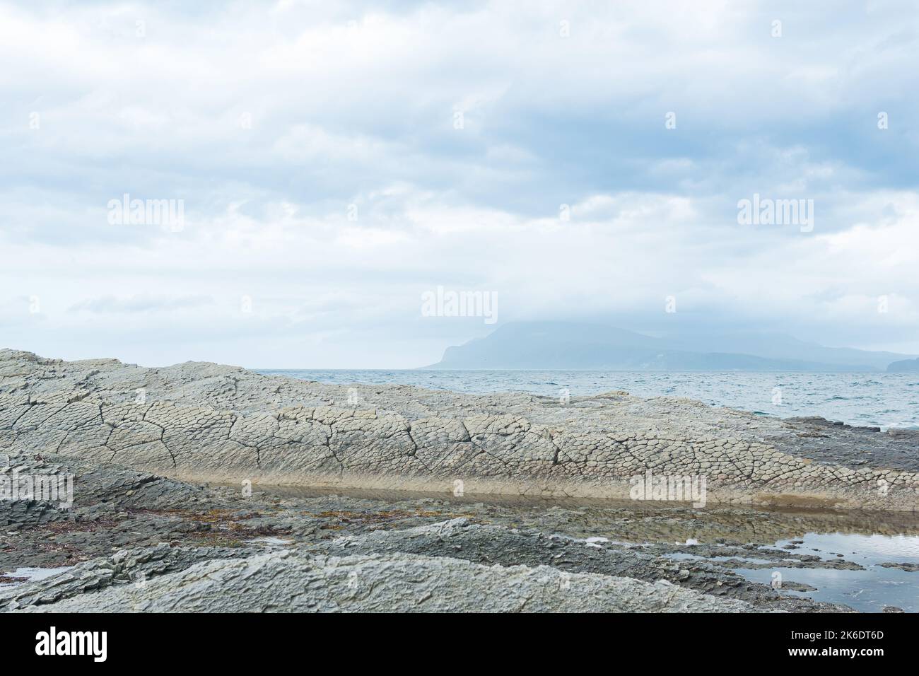 rocky seashore made of columnar granite, hardened lava, resembling ...