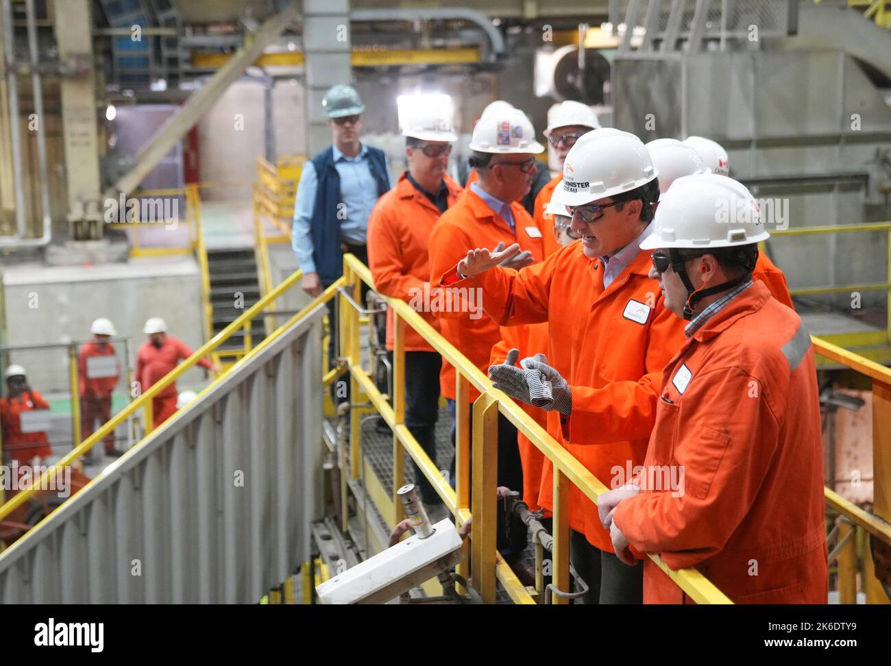 Canadian Prime Minister Justin Trudeau, centre, tours the ArcelorMittal Dofasco steel hot mill ...